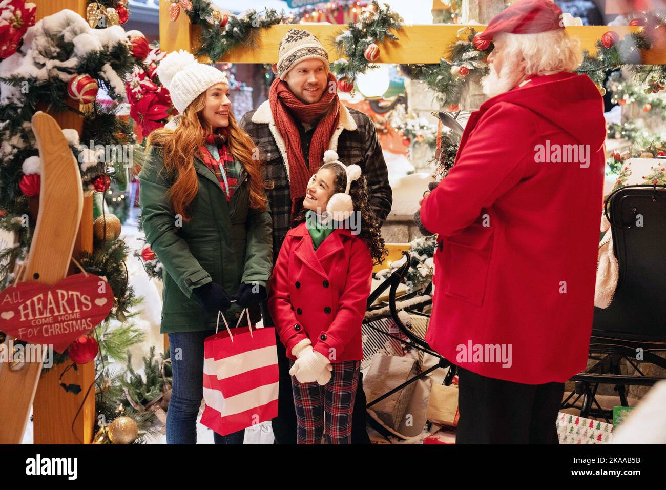 FALLING FOR CHRISTMAS, from left: Lindsay Lohan, Chord Overstreet, Olivia Perez (earmuffs ...
