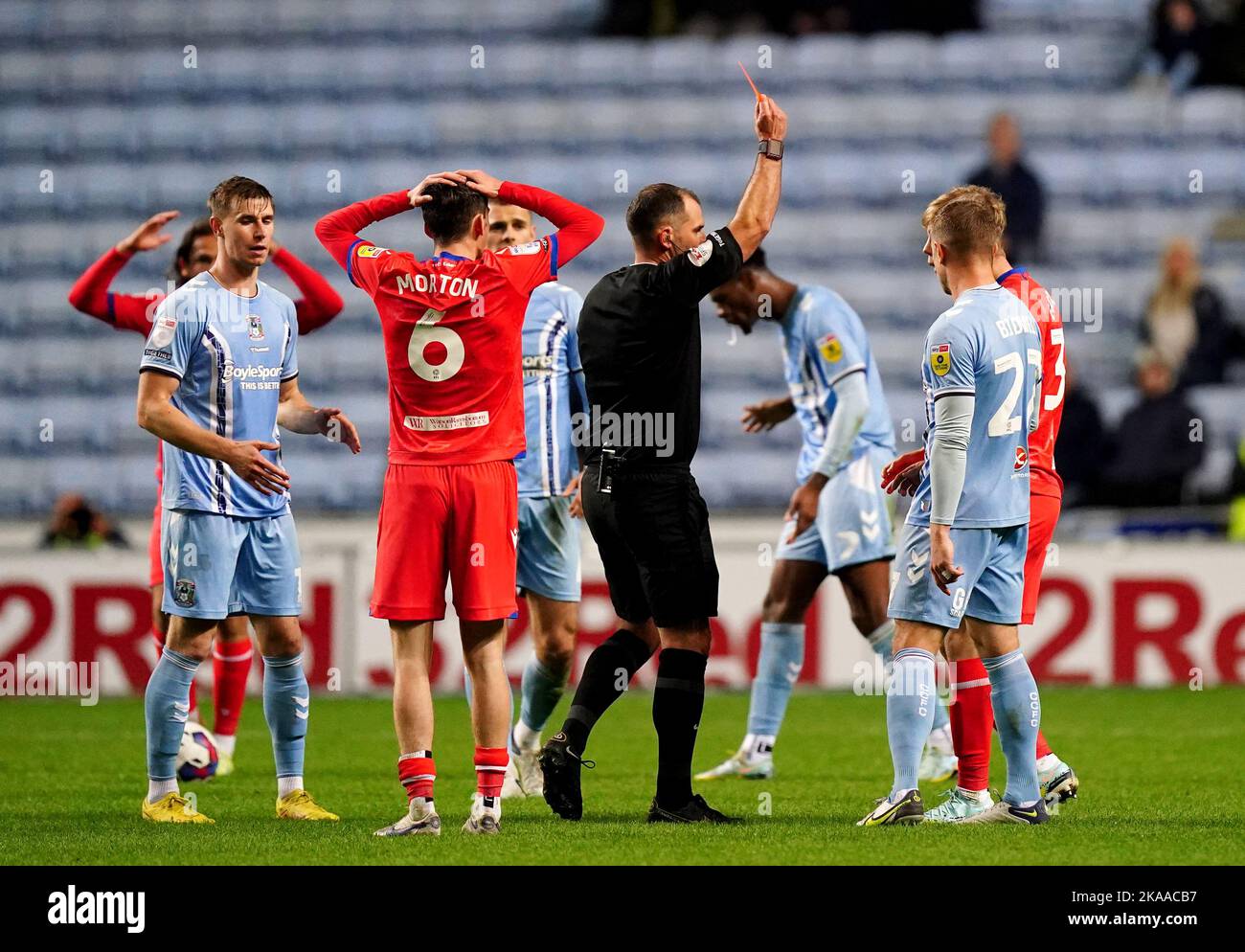 Blackburn Rovers' Jake Garrett is shown a red card during the Sky Bet ...