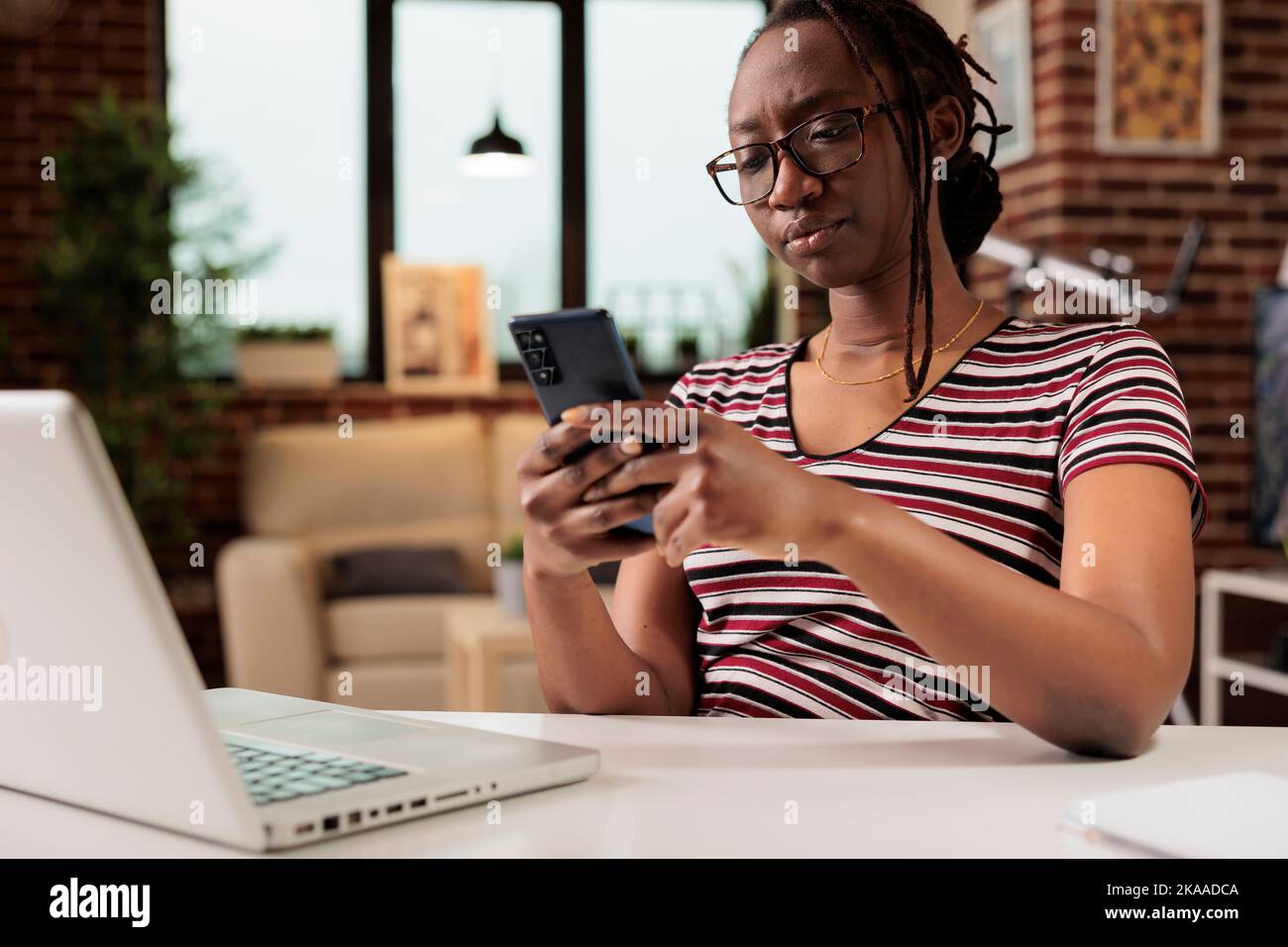 Freelancer typing messages on smartphone, sending sms, chatting in ...