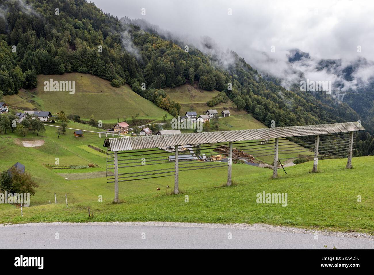 Sorica, village, Slovenia valley and store for logs Stock Photo - Alamy