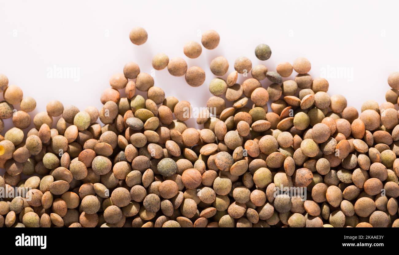 Raw lentils on white background Stock Photo - Alamy