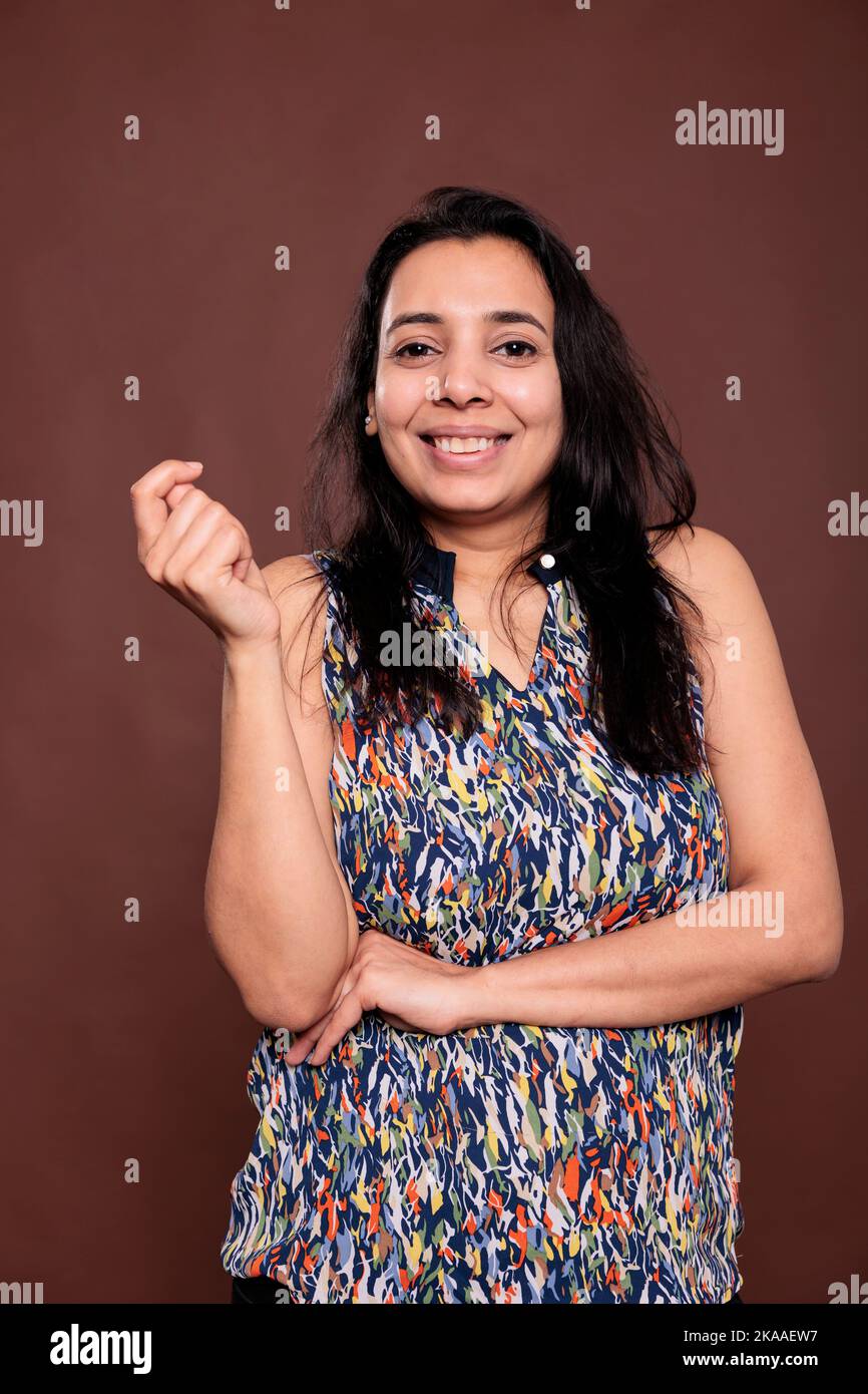 Smiling cheerful indian woman laughing portrait, happy lady holding ...