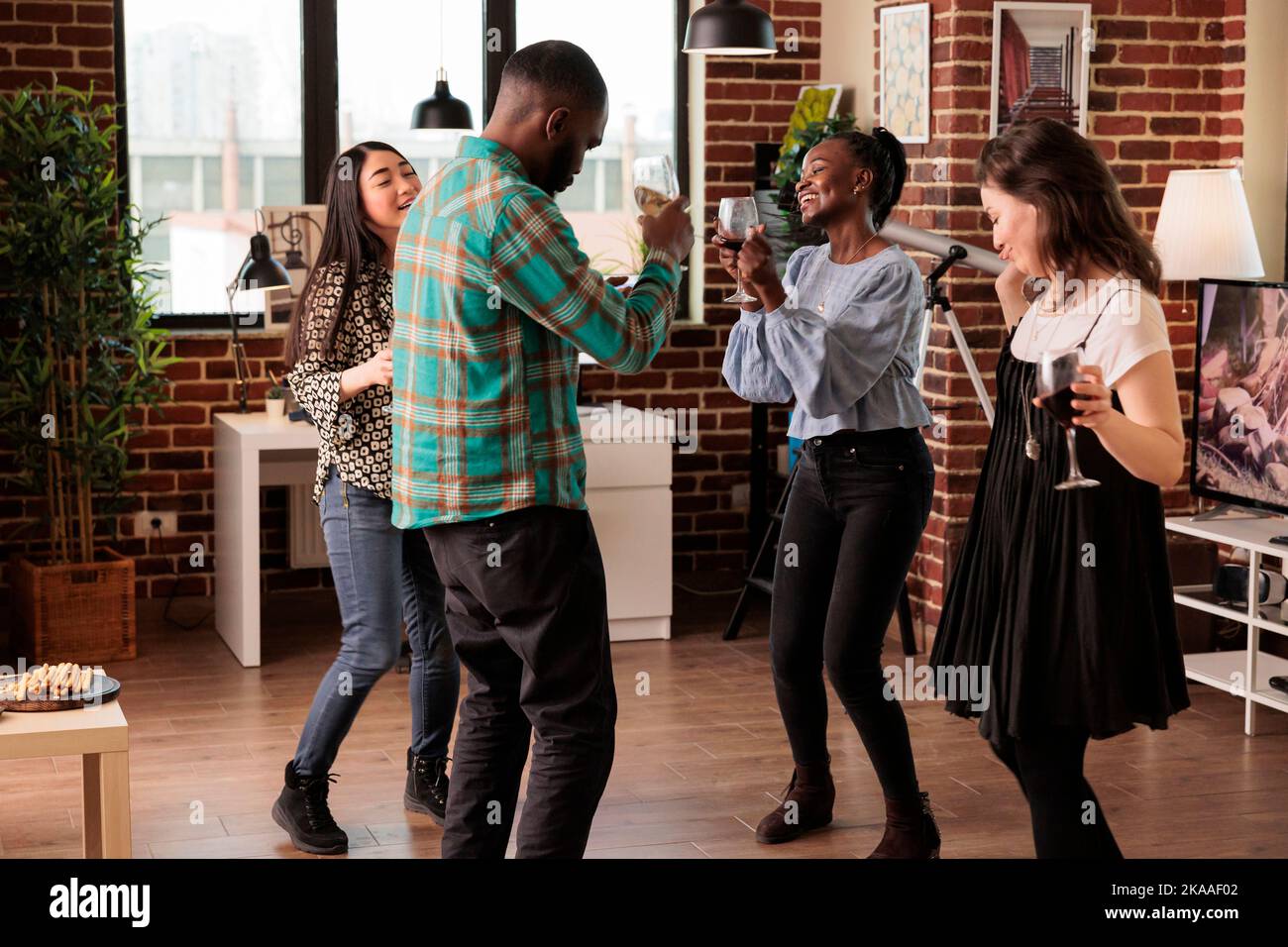 Multicultural, multiethnic people happily, joyfully dancing, drinking ...