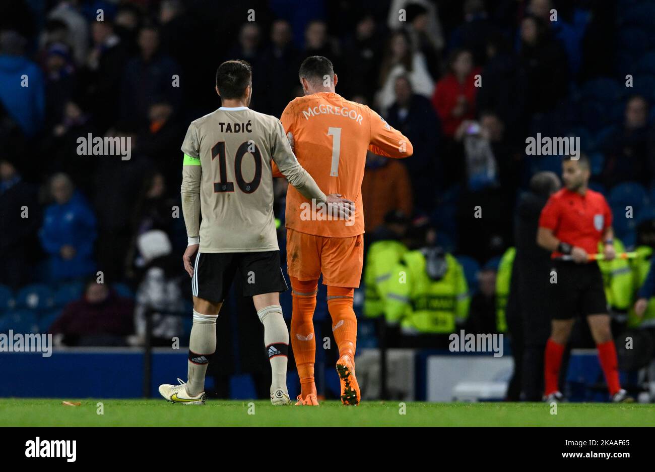 Glasgow, Scotland, 1st November 2022. Dusan Tadic of Ajax consoles Allan McGregor of Rangers as ...