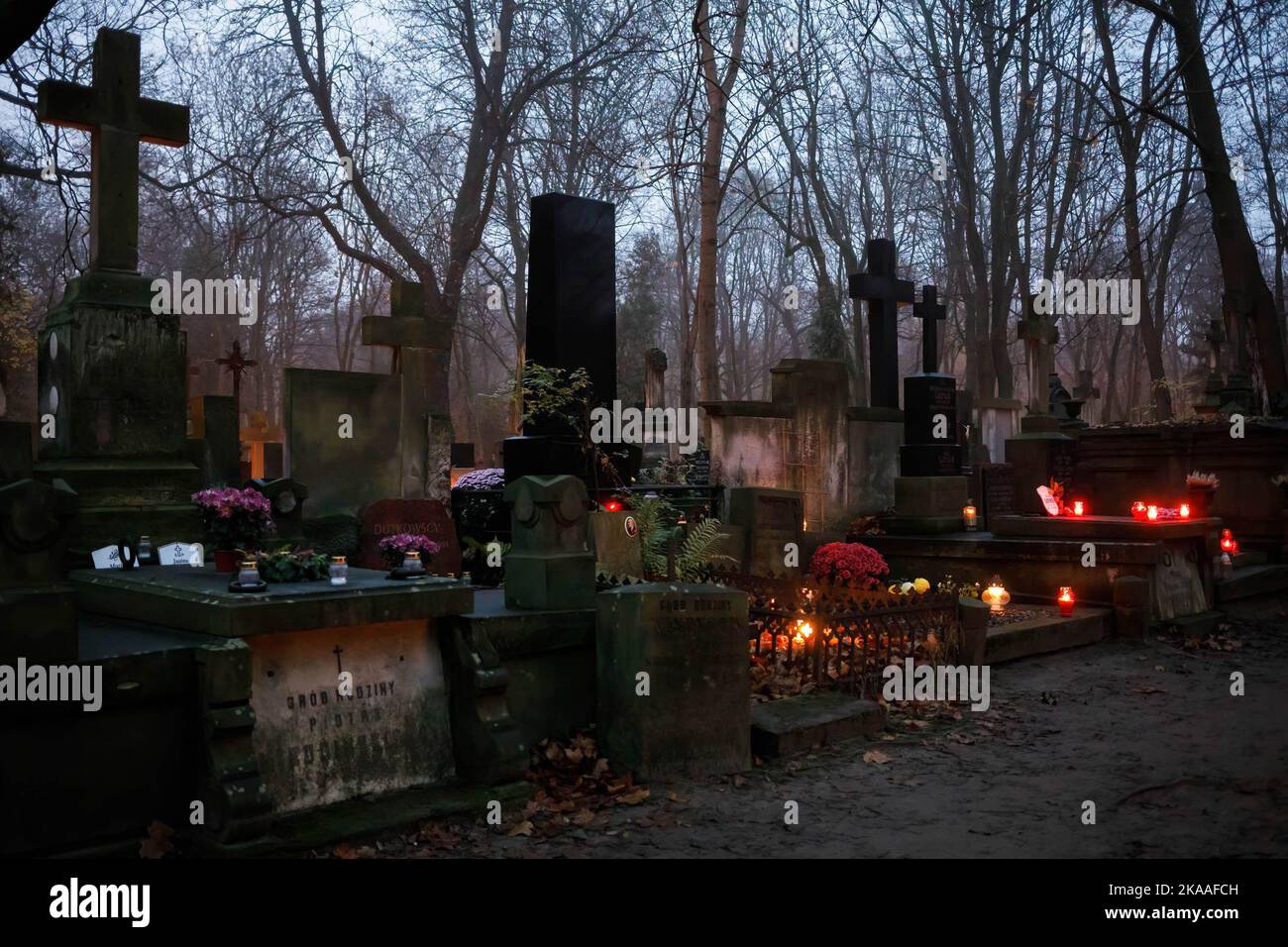 Warsaw, Poland. 01st Nov, 2022. Old tombs with crosses covered with lit ...