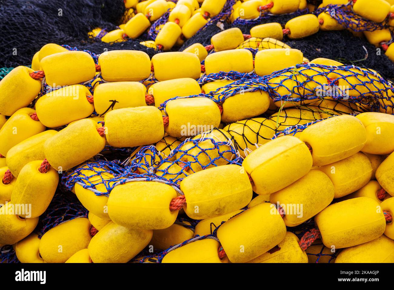 Colorful fishing buoys and floats. Charter and commercial fishing boats ...