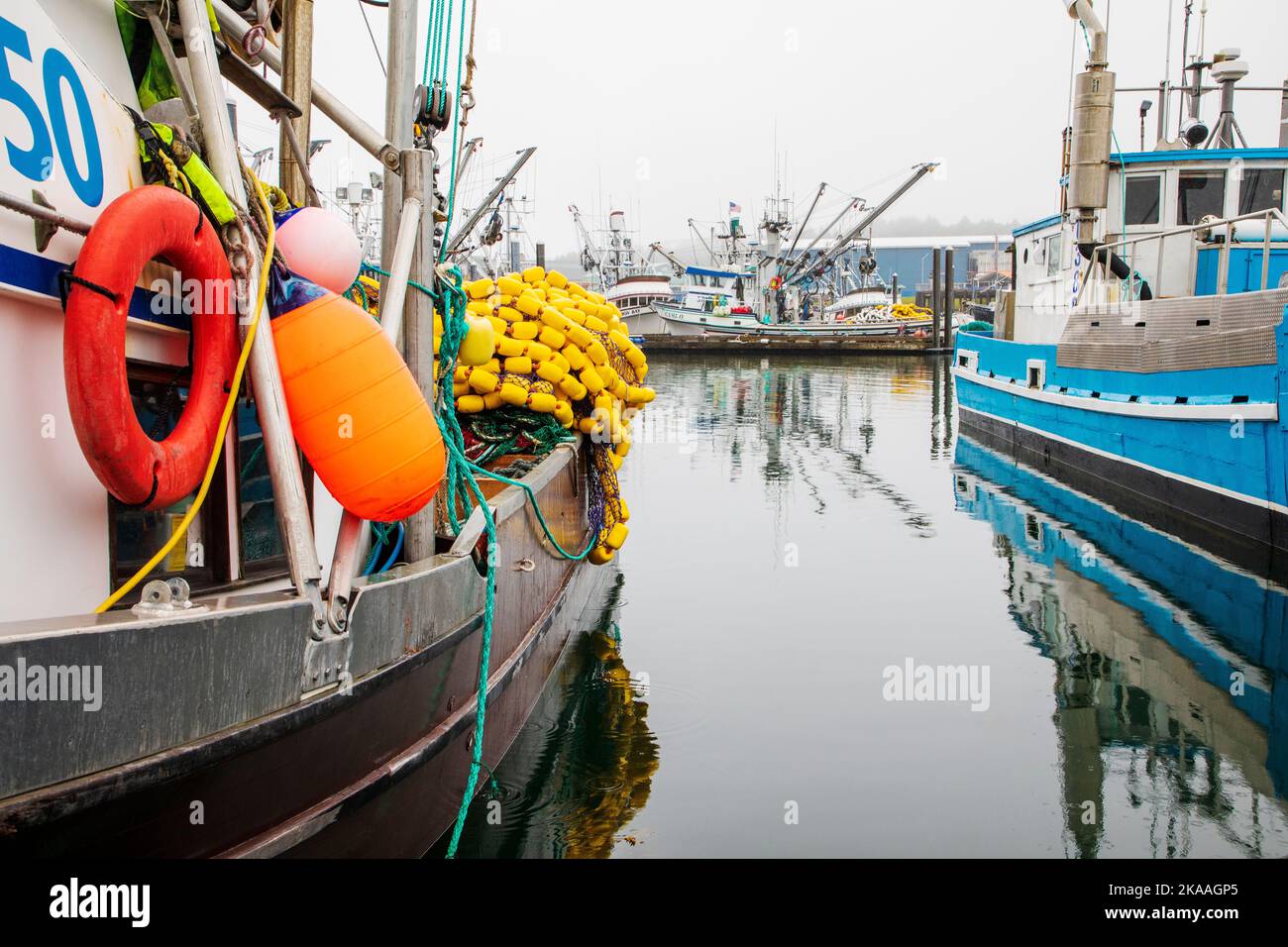Colorful fishing buoys and floats. Charter and commercial fishing boats ...