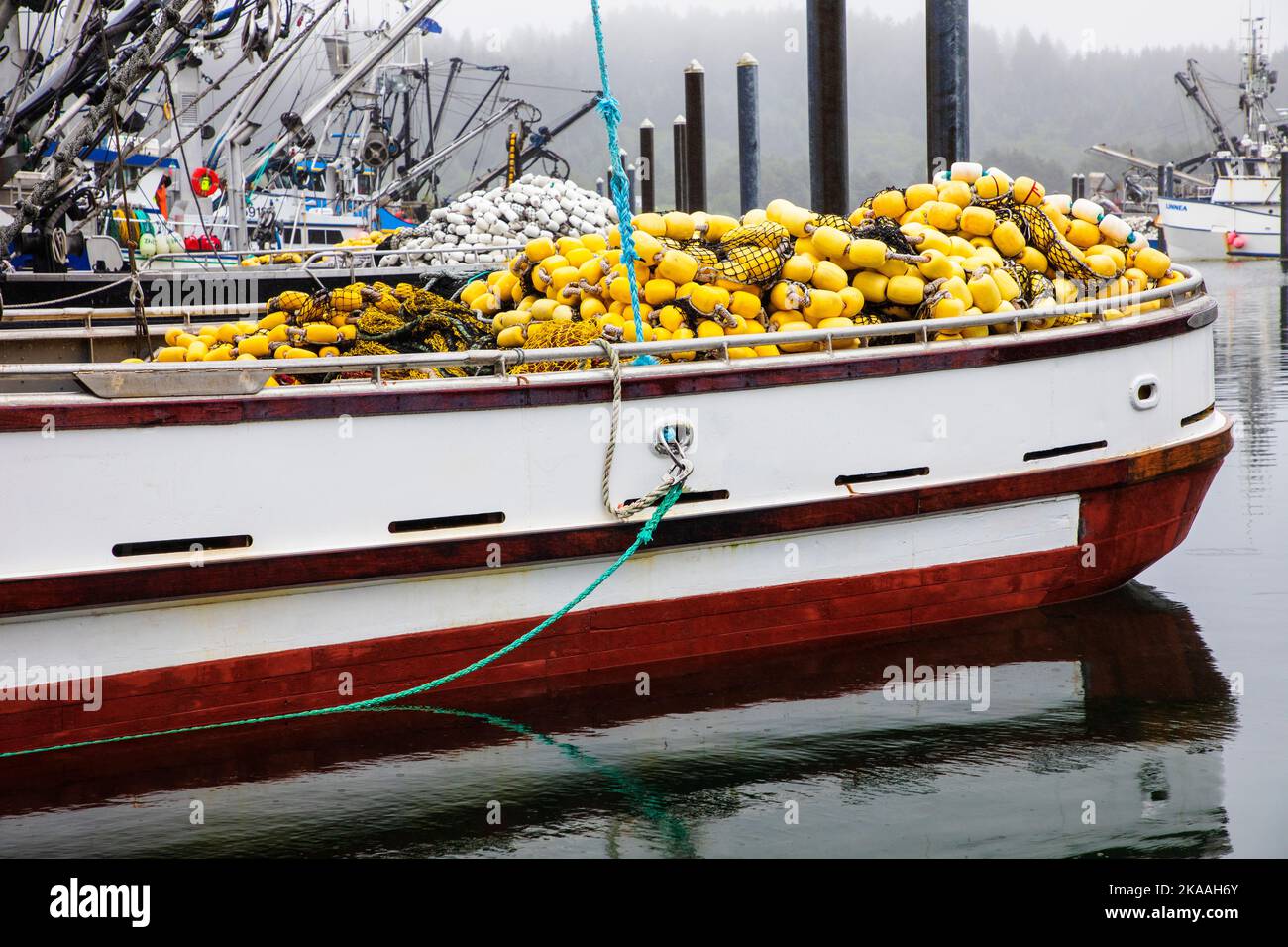 Colorful fishing buoys and floats. Charter and commercial fishing boats ...
