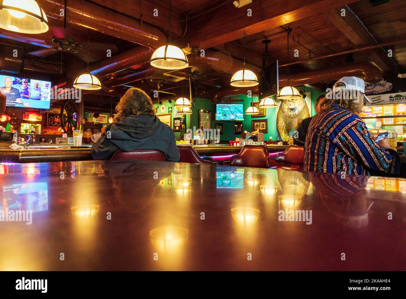 Fisherman eat & drink at Henry's Great Alaskan Restaurant; Kodiak ...