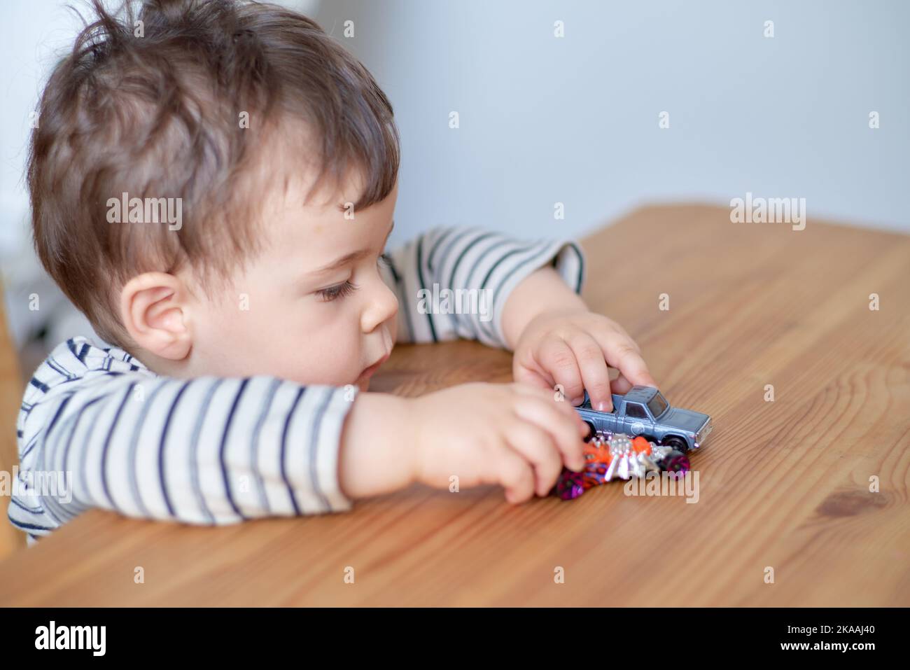 Little boy plaing with his toy cars Stock Photo - Alamy