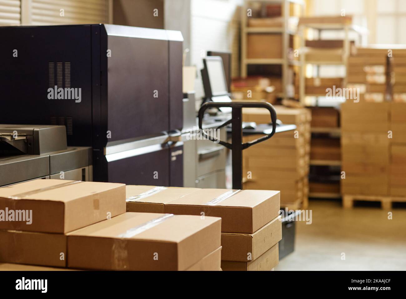 Background image of printing factory workshop with focus on boxes in ...
