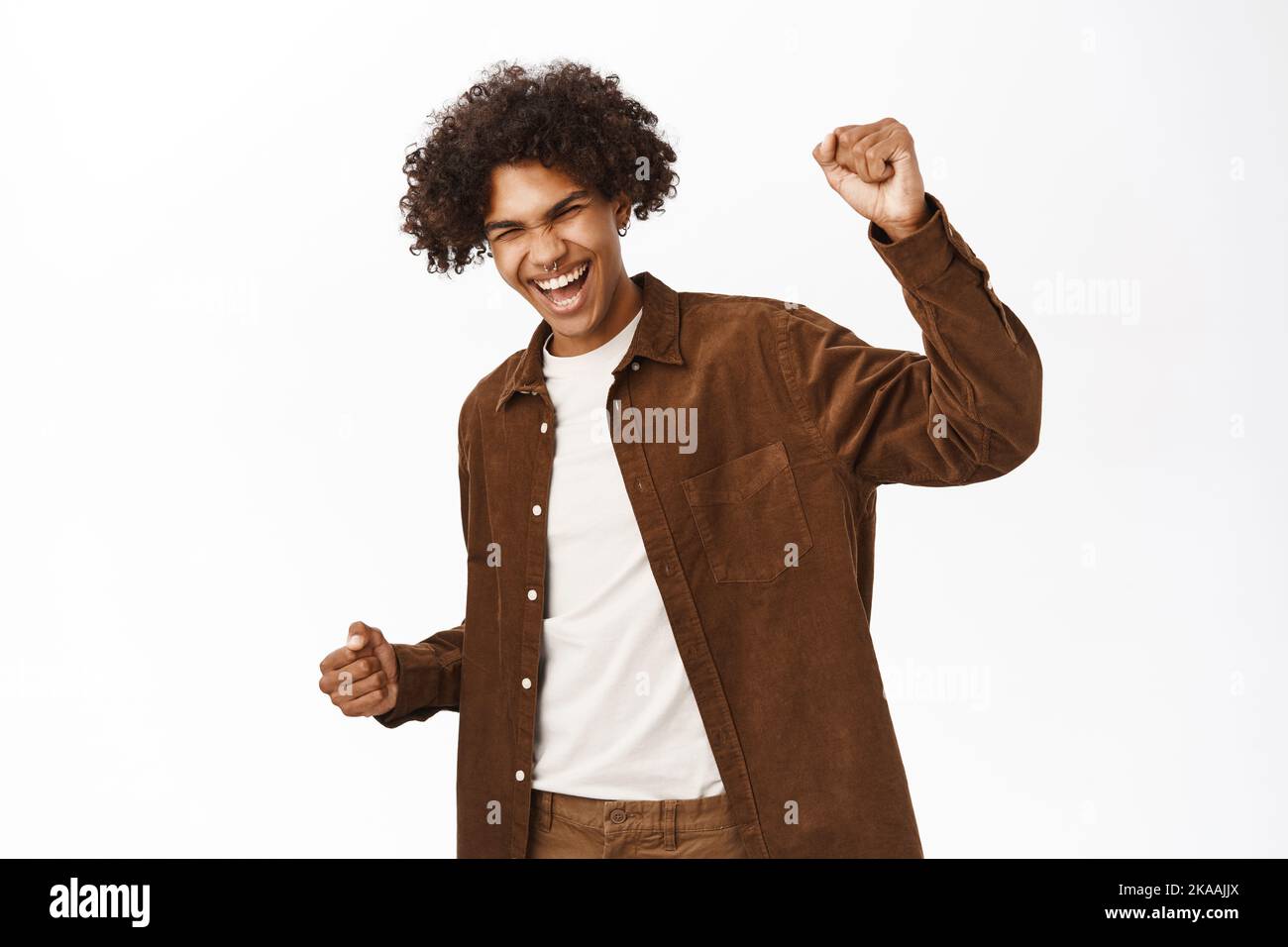 Happy guy triumphing and celebrating, saying yes with ecstatic face ...