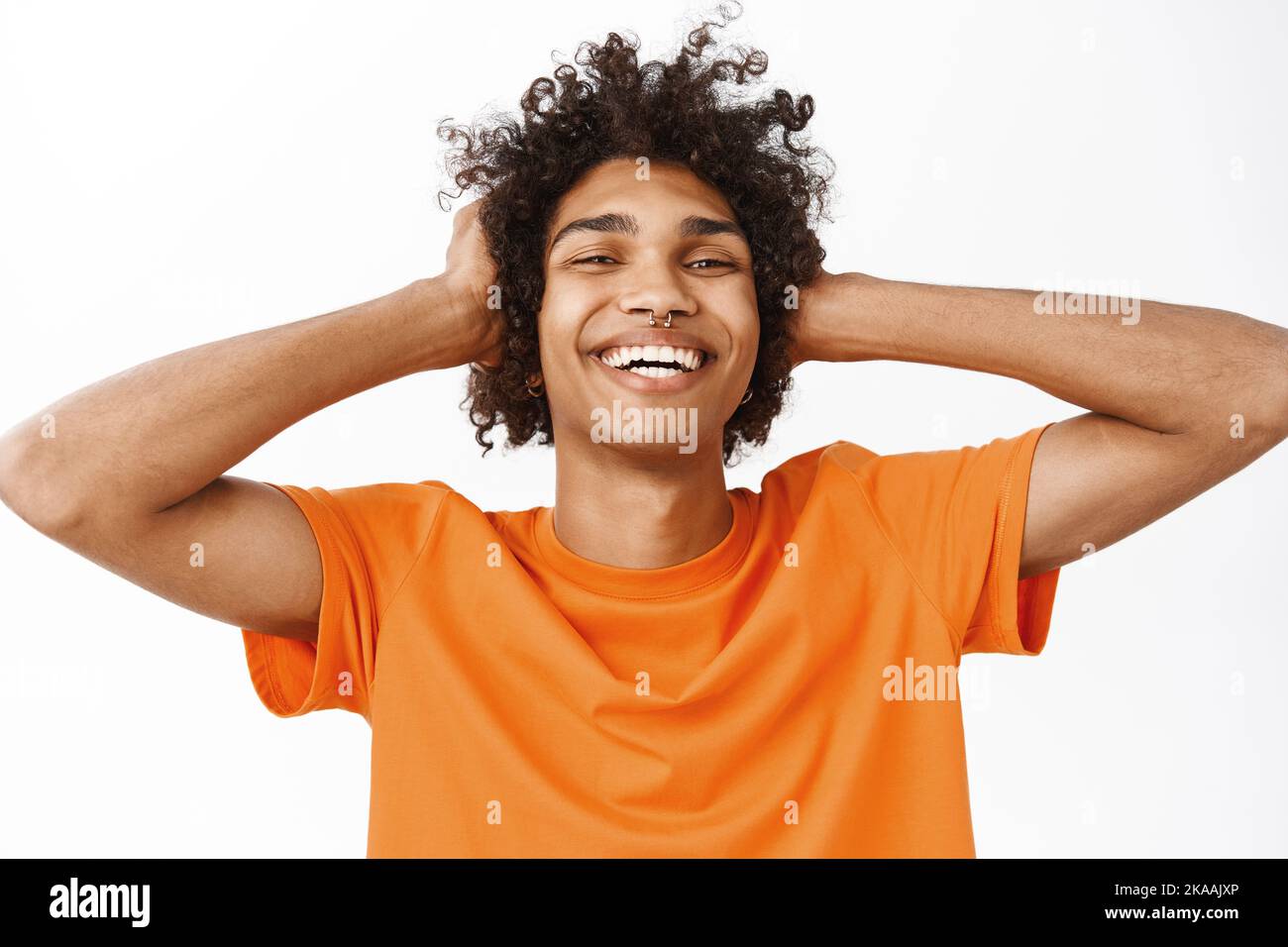 Close up of handsome hispanic boy, guy showing his curly healthy ...