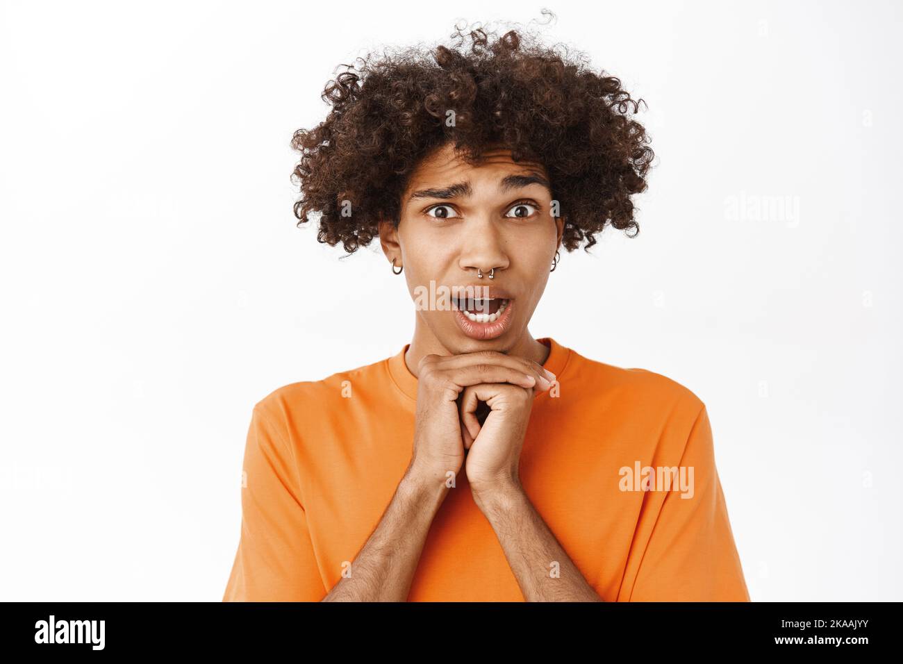 Close up of boy looking worried and concerned, expression compassion ...