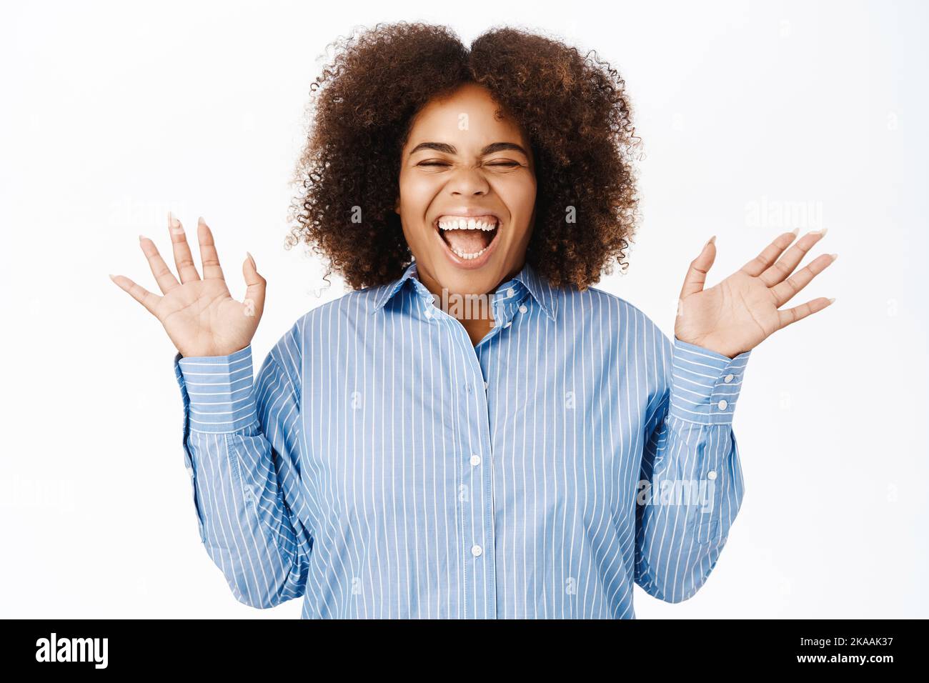 Cheerful woman celebrates success office hi-res stock photography and ...