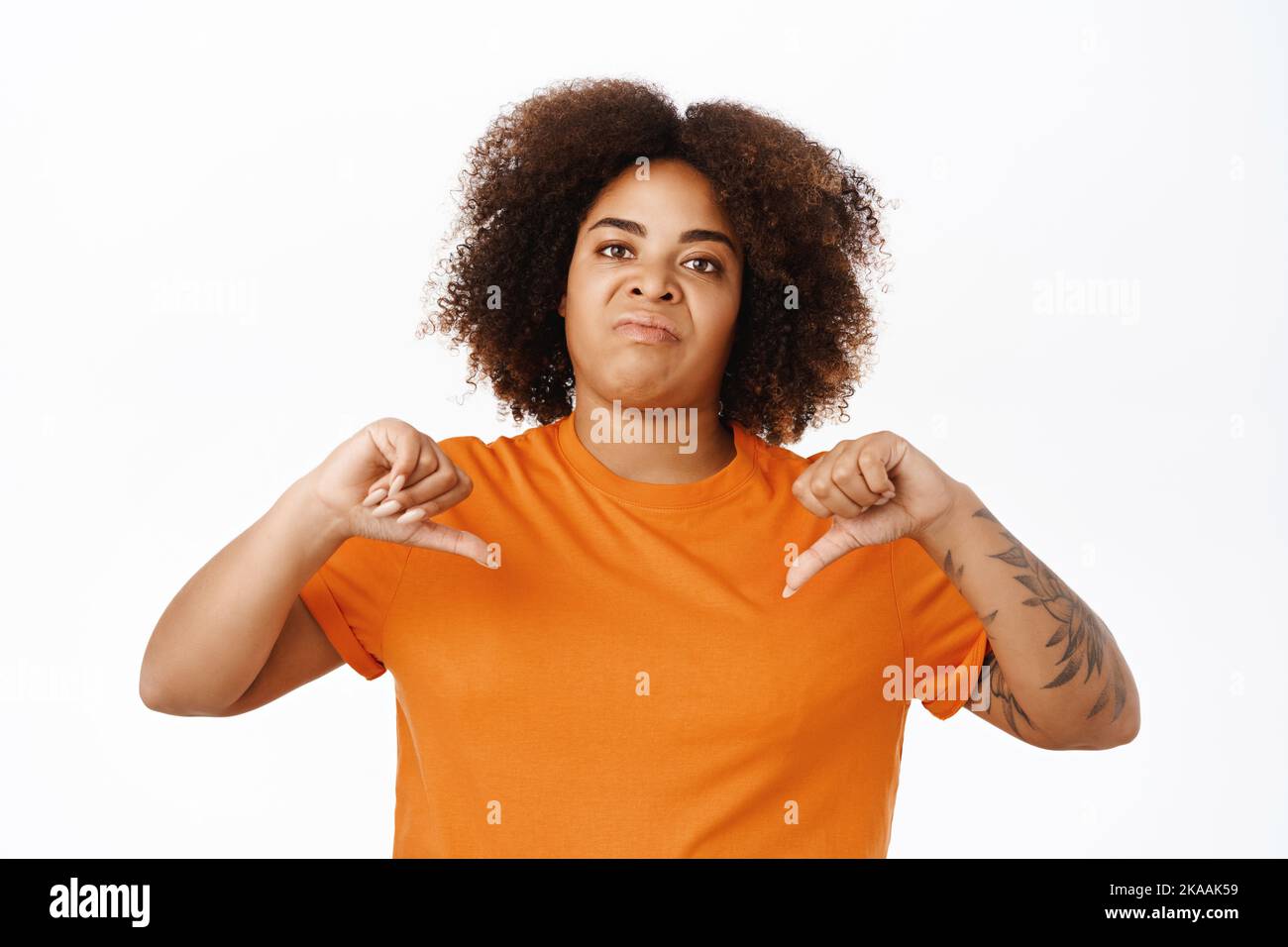 Very bad, not good. Upset african american woman shows thumbs down ...