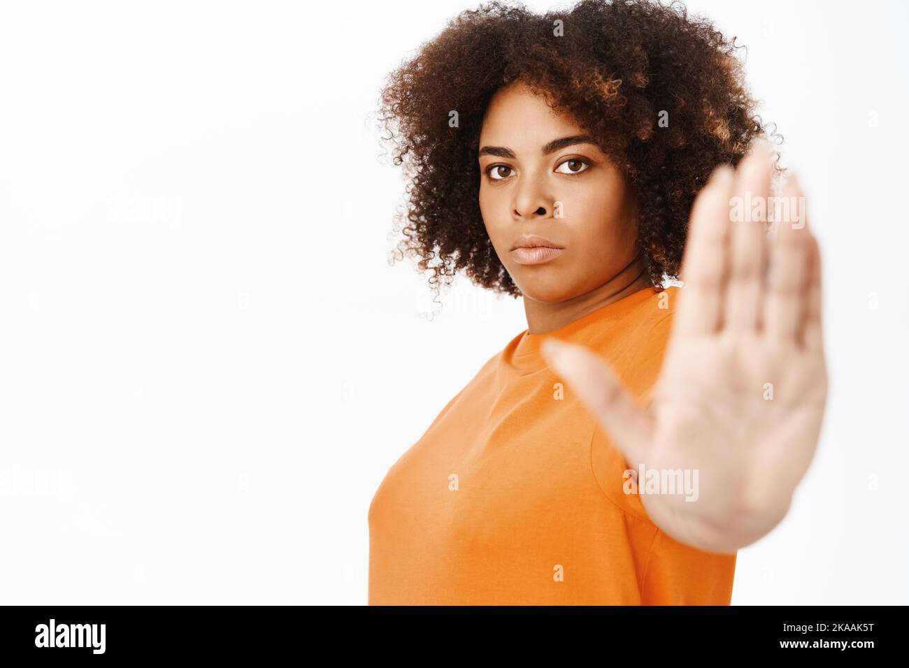 Stop. Portrait of serious african american extends hand and looks ...