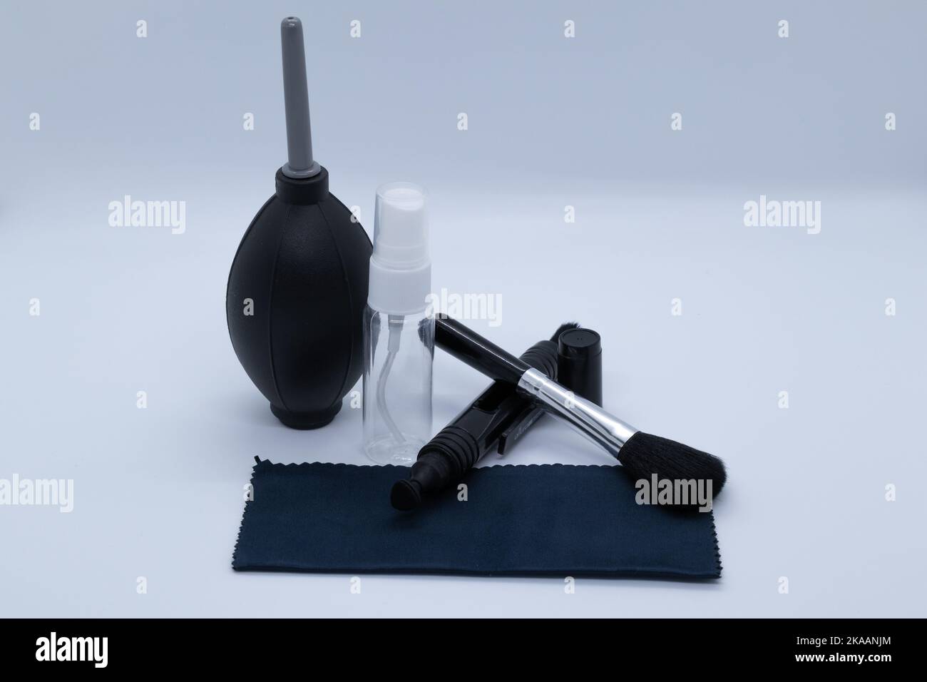 Cleaning supplies for cameras and various objects on a white background ...