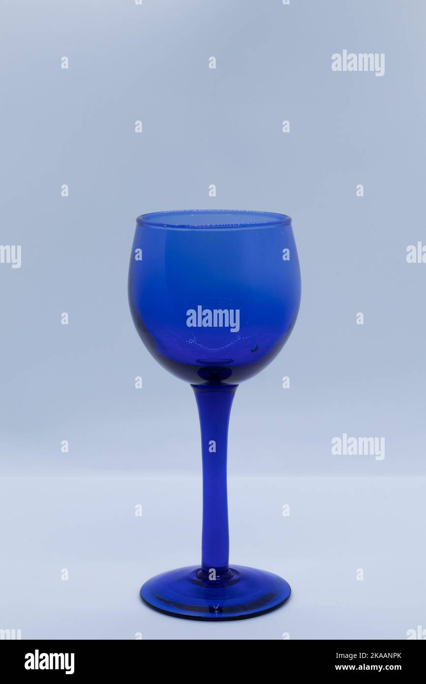 Blue color glass goblet for wine Stock Photo - Alamy