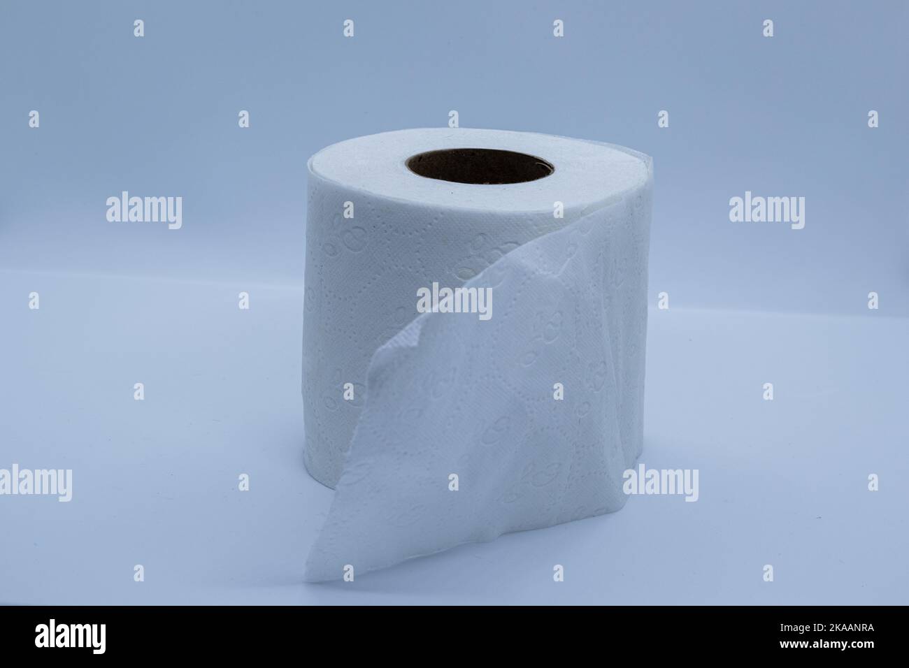 White toilet paper on a white background with contrast Stock Photo - Alamy
