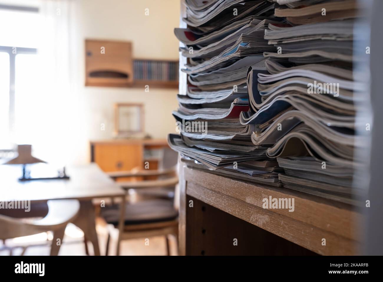 Paper notebooks used and stacked on a rack shelf, cozy office Stock ...