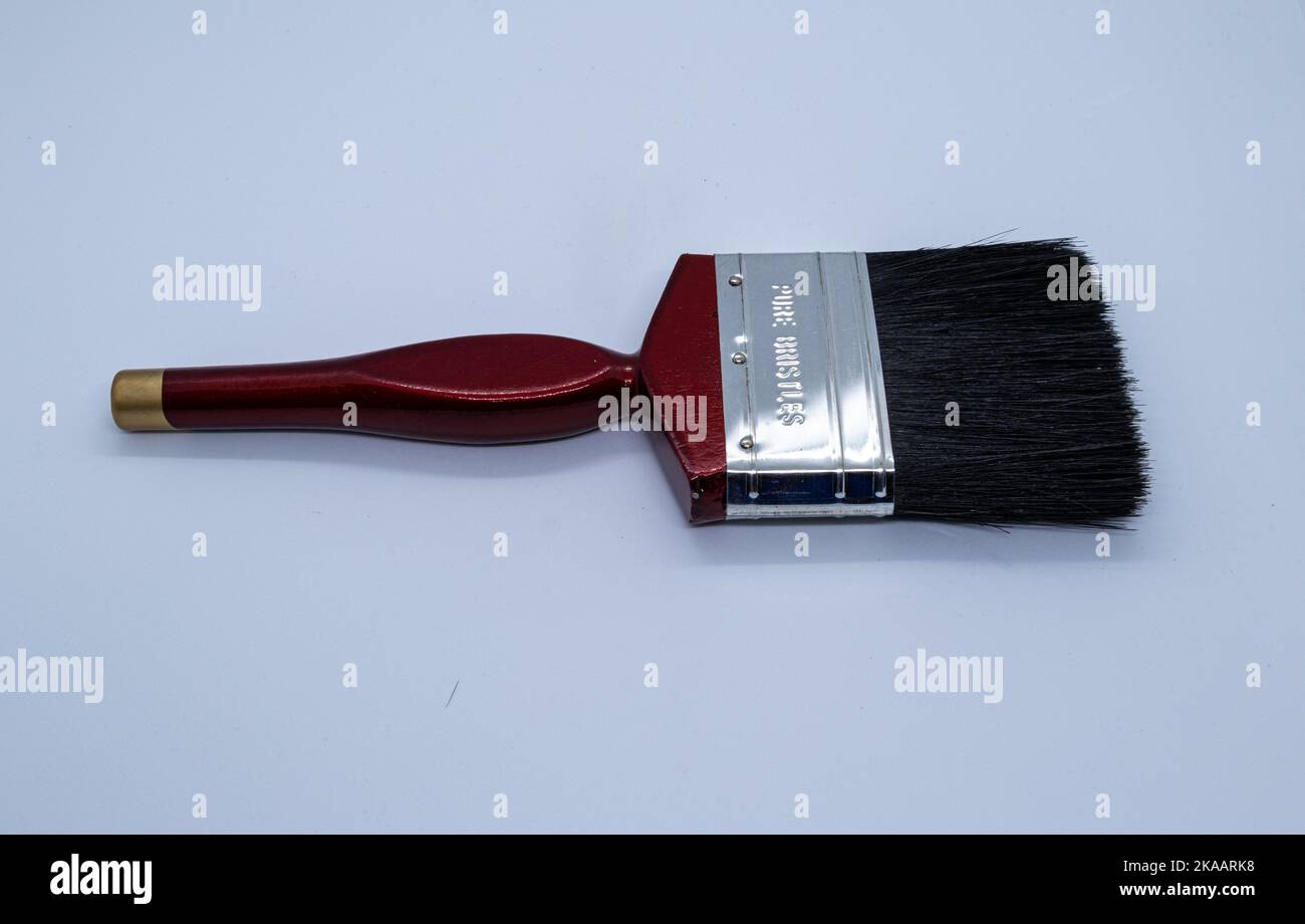 Black and red paint brushes on white background Stock Photo - Alamy