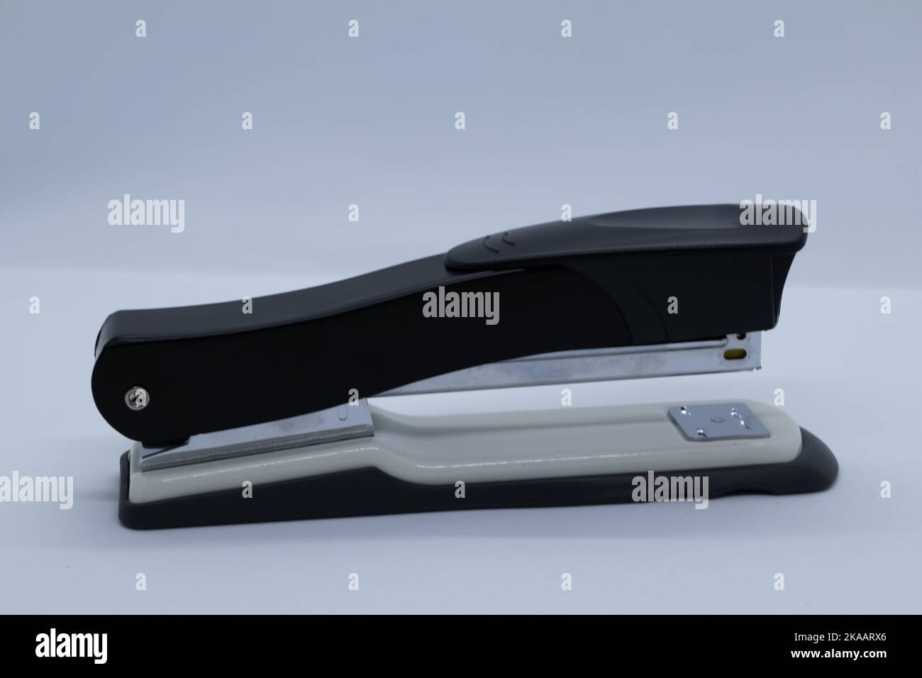 Black stapler with gray on white background Stock Photo - Alamy