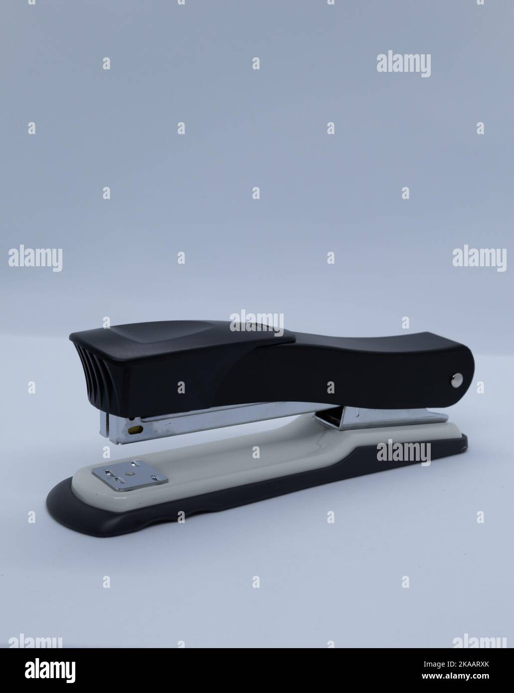 Black stapler with gray on white background Stock Photo - Alamy