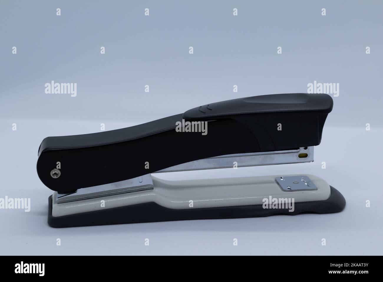 Black stapler with gray on white background Stock Photo - Alamy