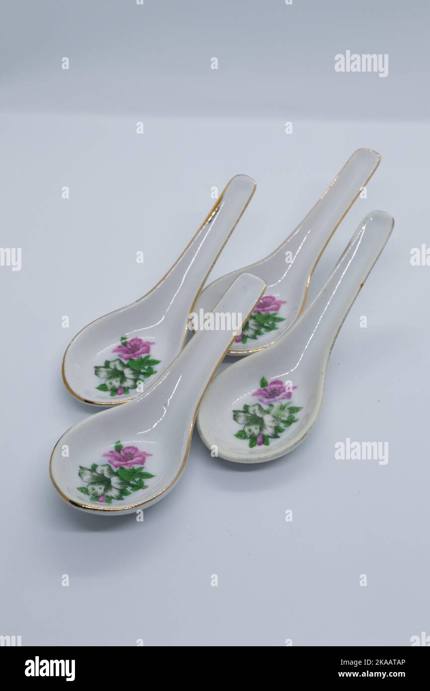 Classic asian patterned soup ladles on white background Stock Photo - Alamy