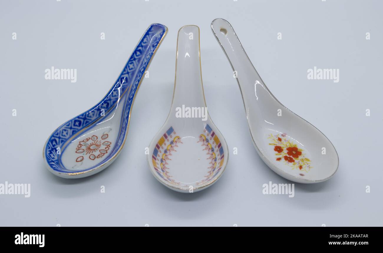 Classic asian patterned soup ladles on white background Stock Photo - Alamy