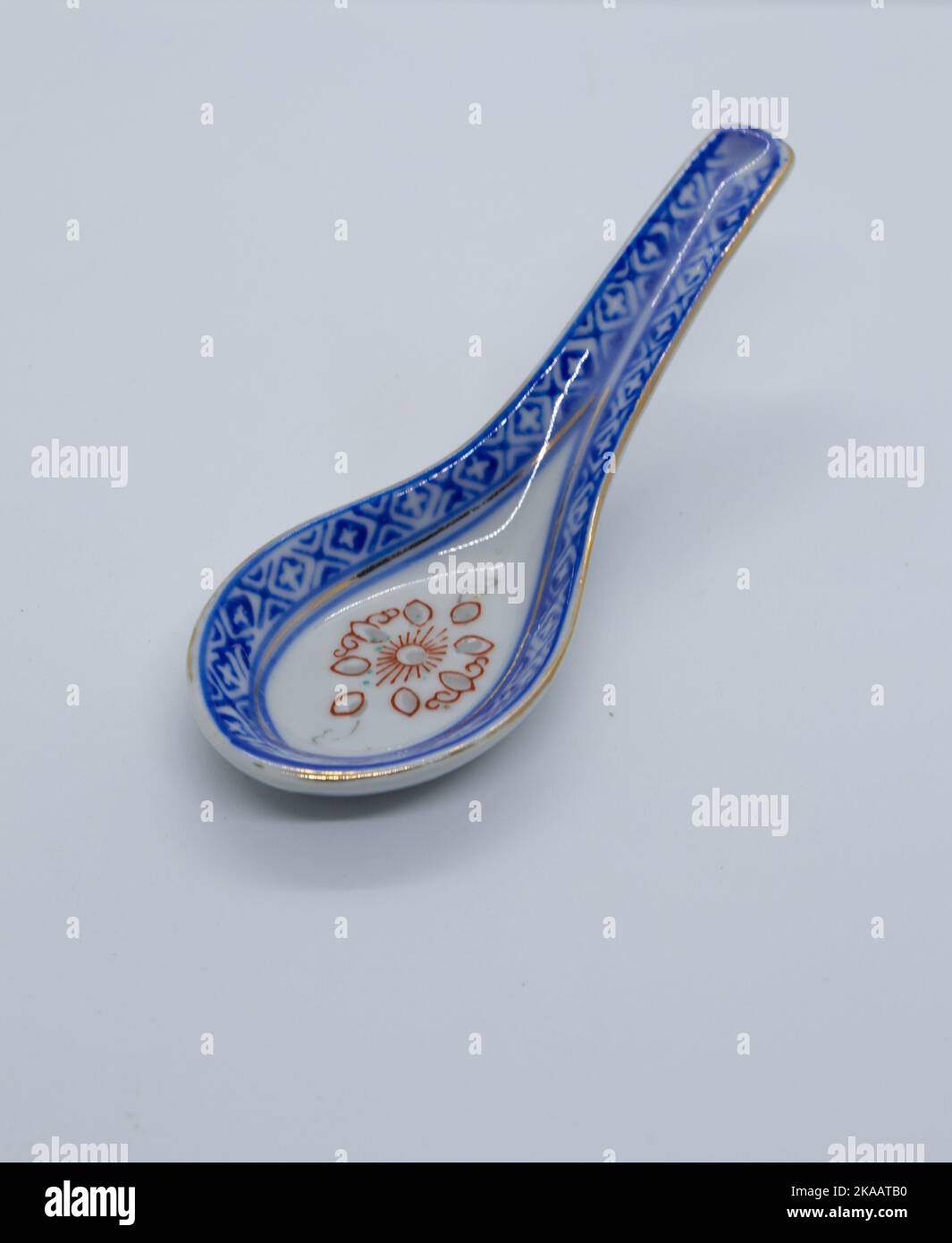 Classic asian patterned soup ladles on white background Stock Photo - Alamy