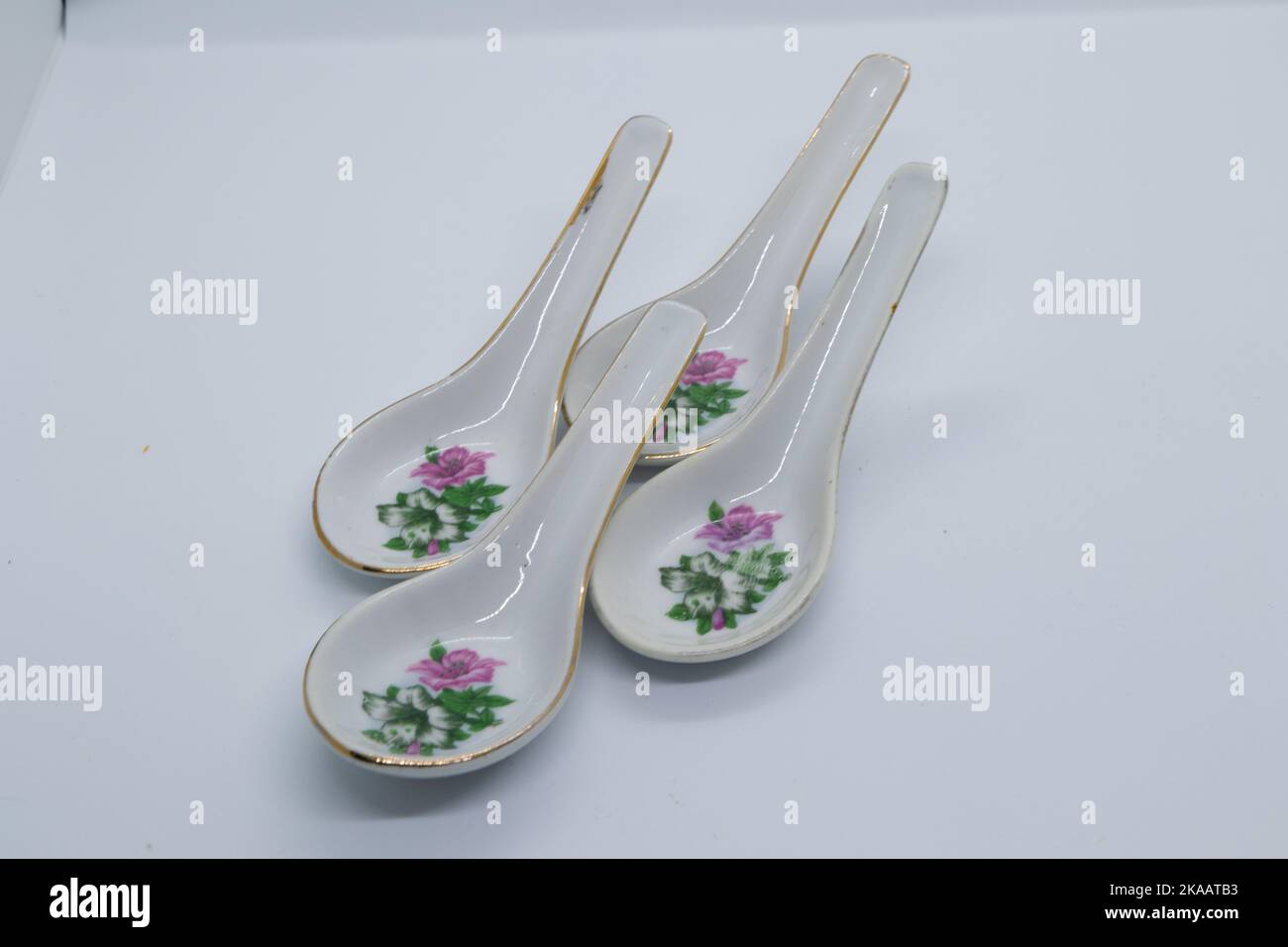 Classic asian patterned soup ladles on white background Stock Photo - Alamy