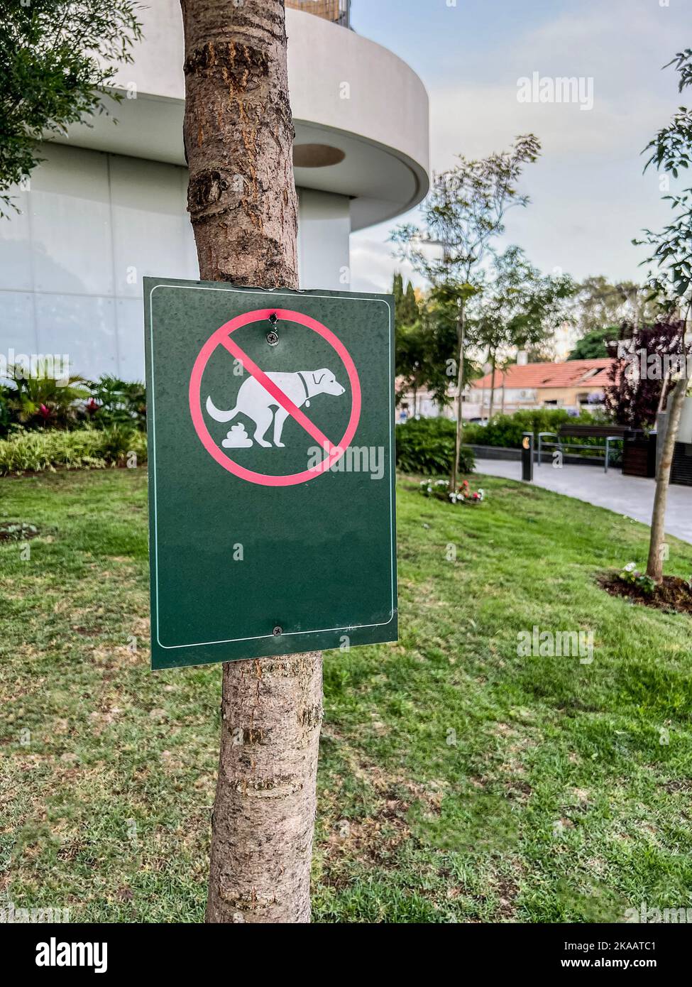 Warning sign on green lawn Stock Photo - Alamy