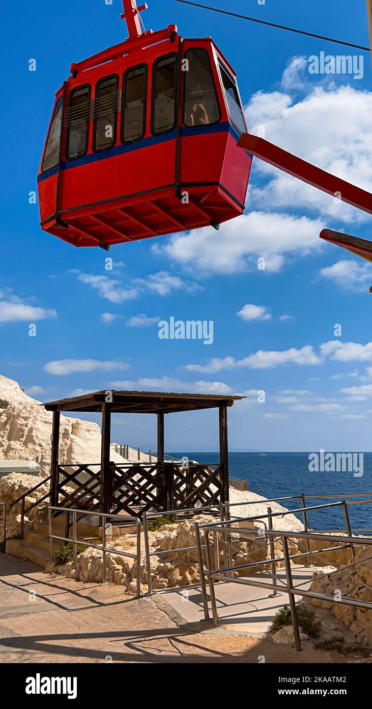 Red cable car cabin lifting up mountain Stock Photo - Alamy