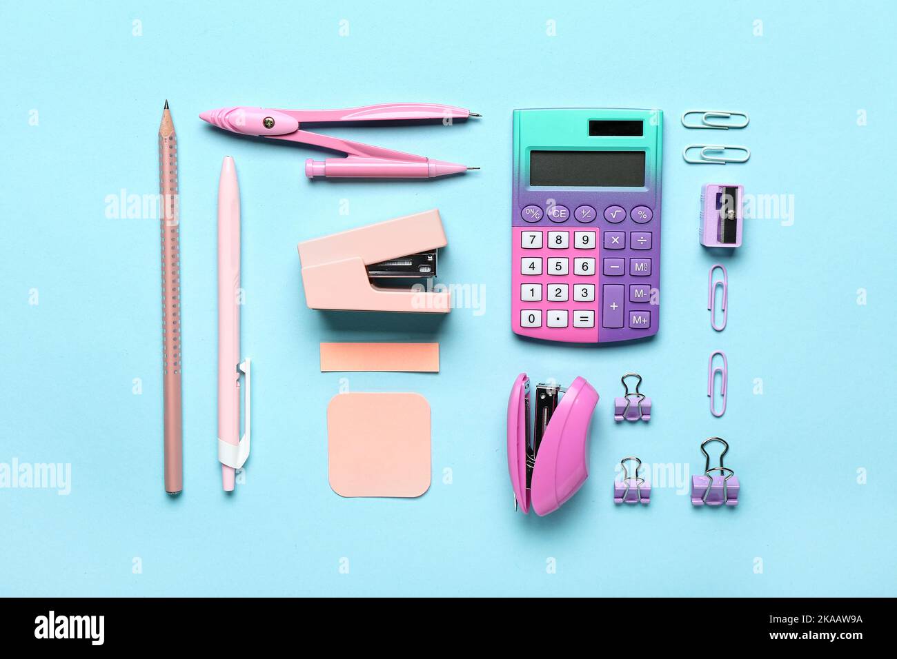 Set of different stationery with staplers on color background Stock ...