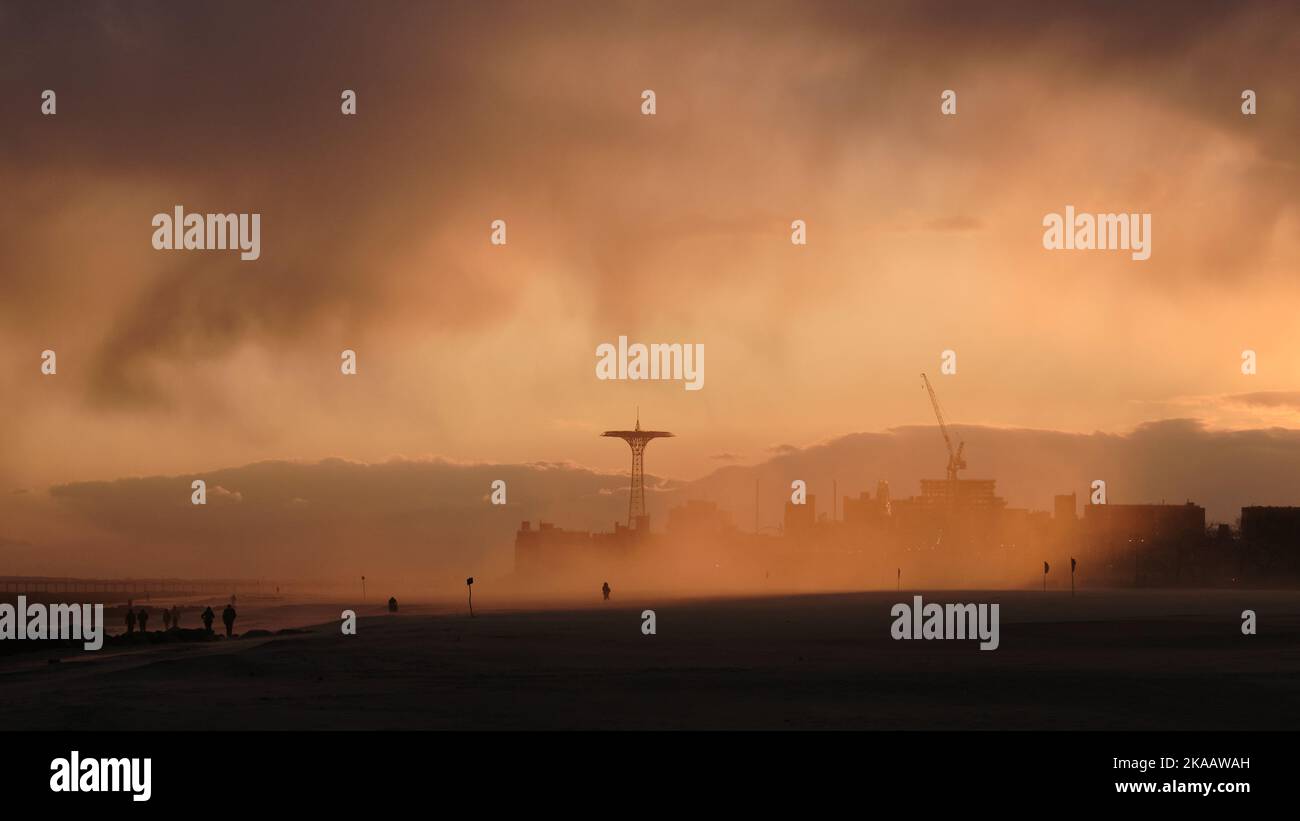 Sudden sand storm on the beach at Coney Island at Sunset during the ...