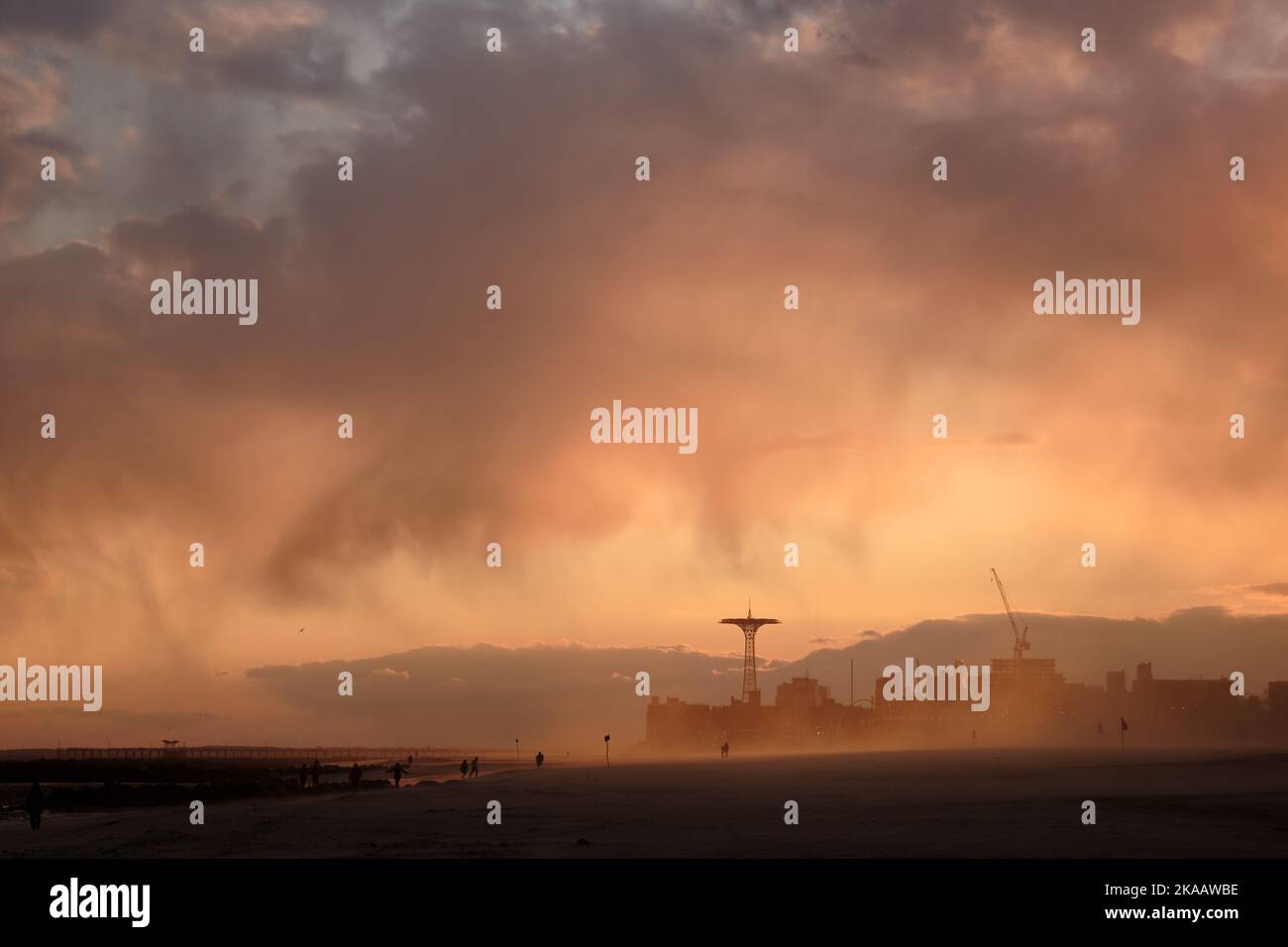 Sudden sand storm on the beach at Coney Island at Sunset during the ...