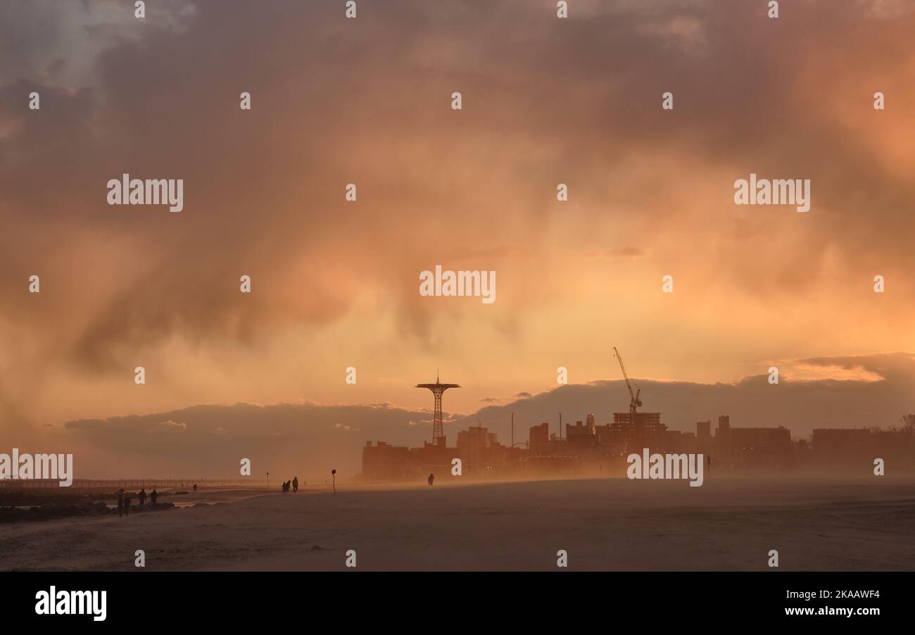 Sudden sand storm on the beach at Coney Island at Sunset during the ...
