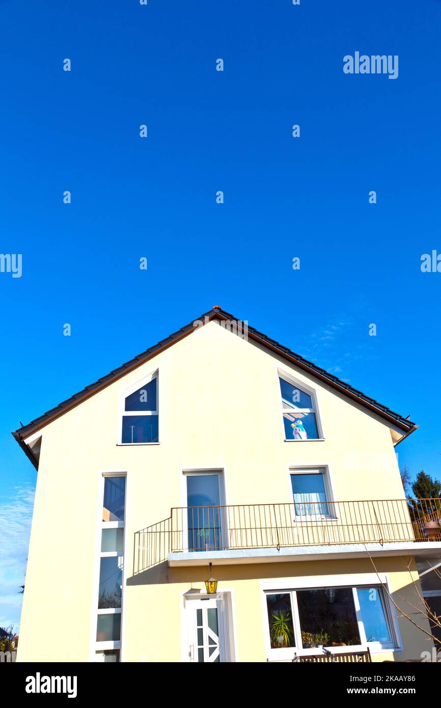 generic family home in suburban area with blue sky Stock Photo - Alamy