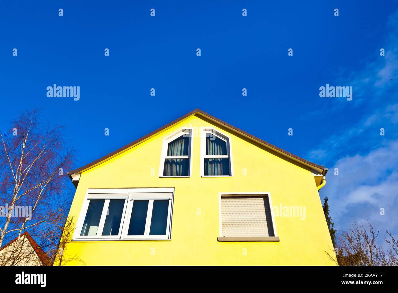 facade of house with blue sky Stock Photo - Alamy