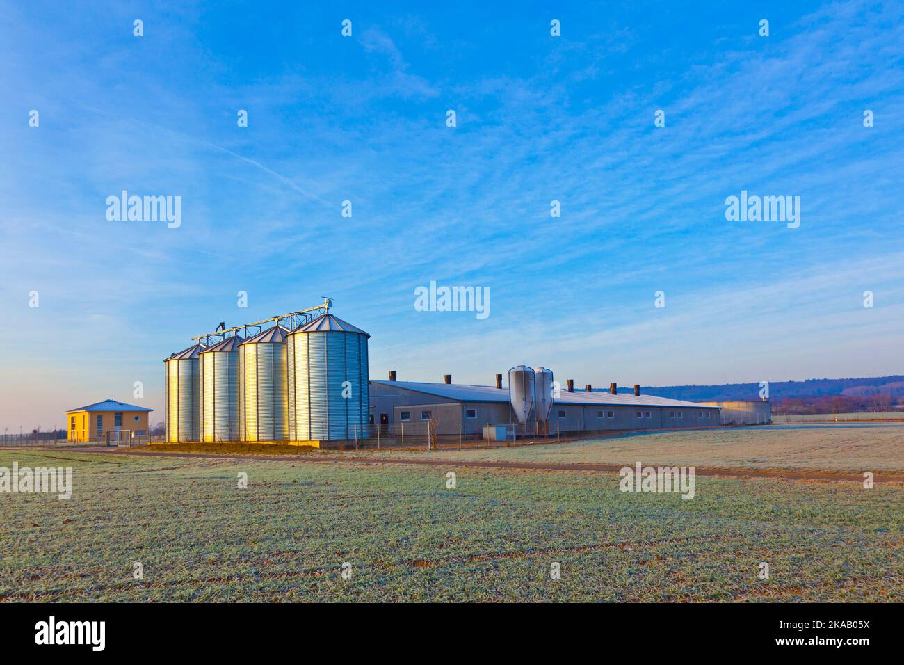 silos in the middle of a field in wintertime Stock Photo - Alamy