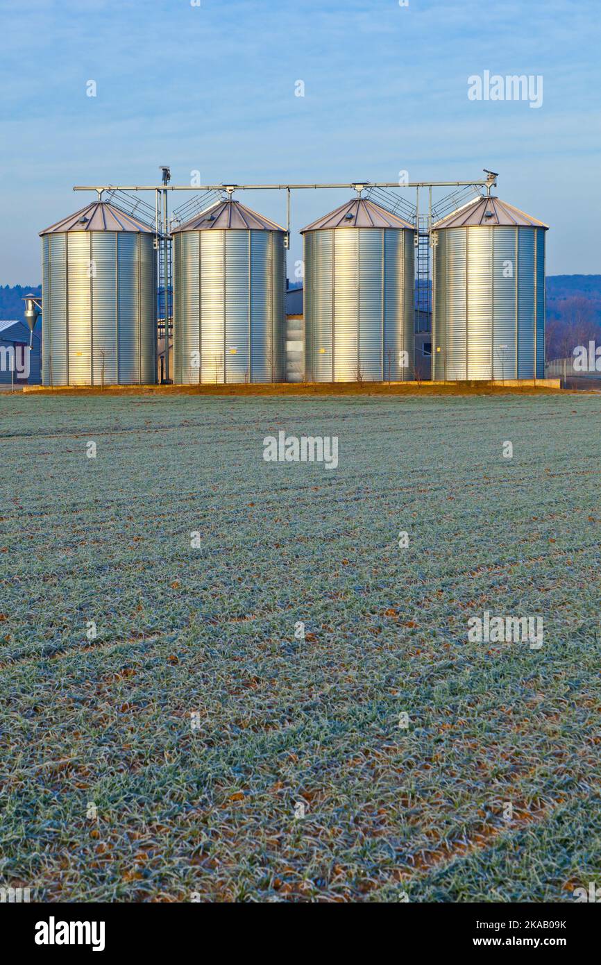 silos in the middle of a field in wintertime Stock Photo - Alamy