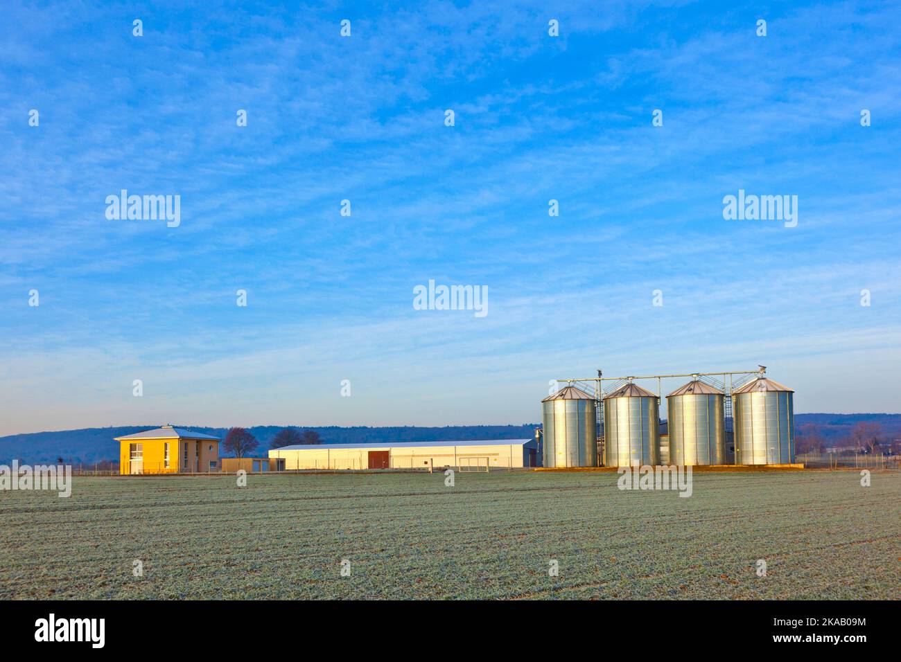 silos in the middle of a field in wintertime Stock Photo - Alamy