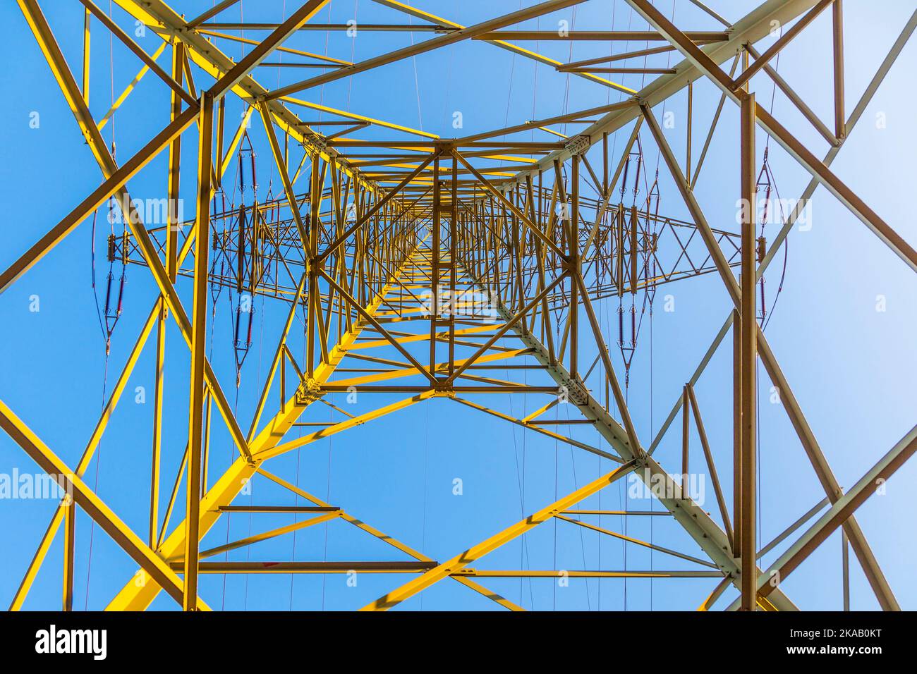 electrical pylon under blue sky, power line cable Stock Photo - Alamy