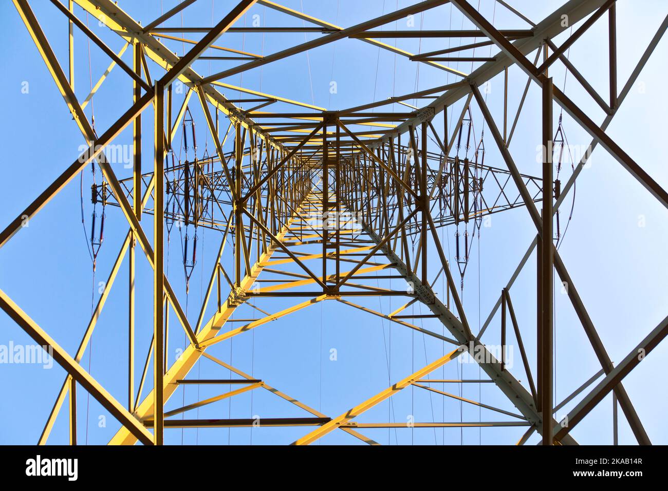 electrical pylon under blue sky, power line cable Stock Photo - Alamy