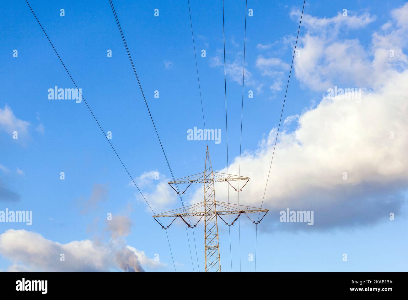 electrical pylon power tower under blue sky Stock Photo - Alamy