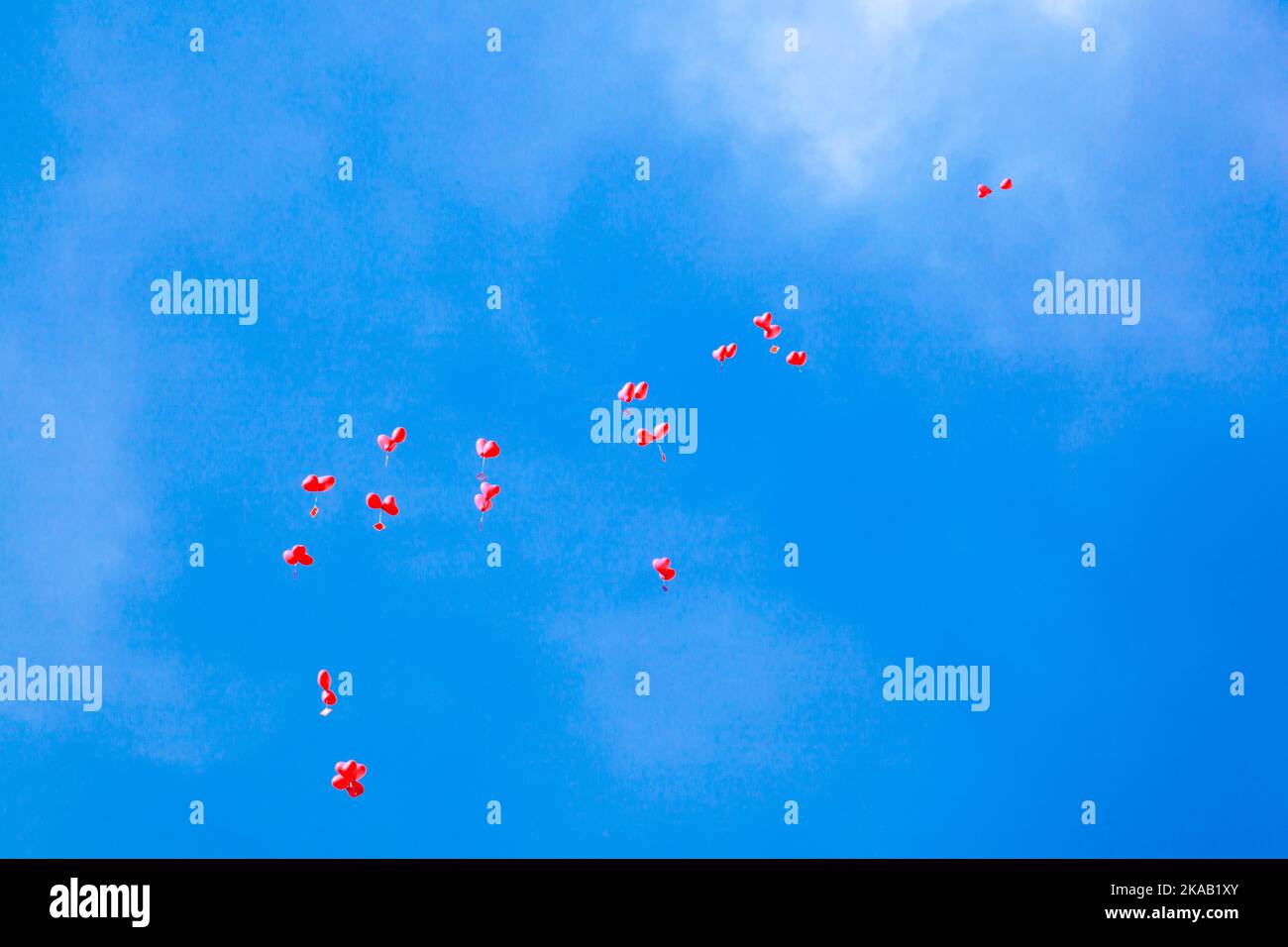 Red balloons with the messages in the blue sky Stock Photo - Alamy