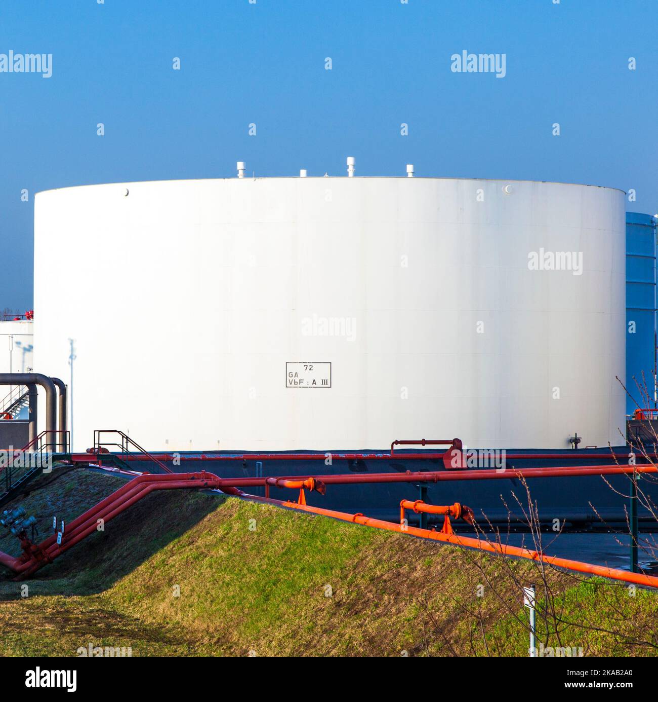 white tank in tank farm with blue sky Stock Photo - Alamy