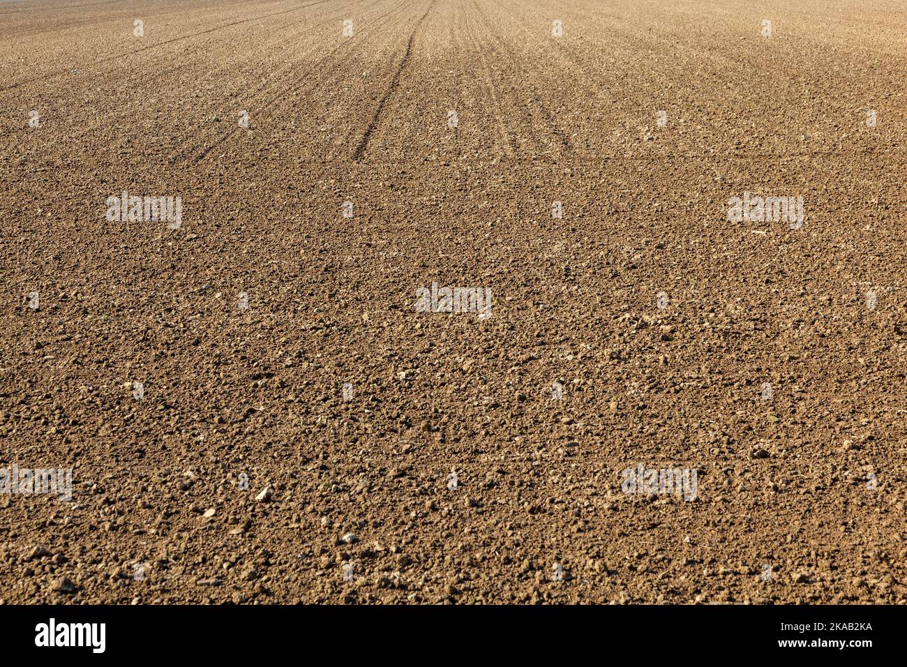 freshly ploughed field in spring before the sead Stock Photo - Alamy